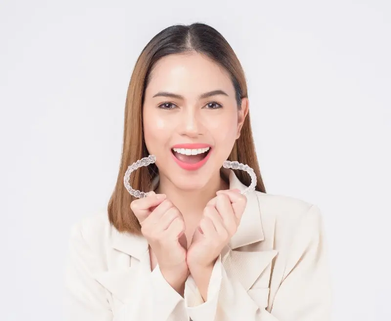 Wearing Invisalign Aligners with Crowns, Veneers, Implants, and More